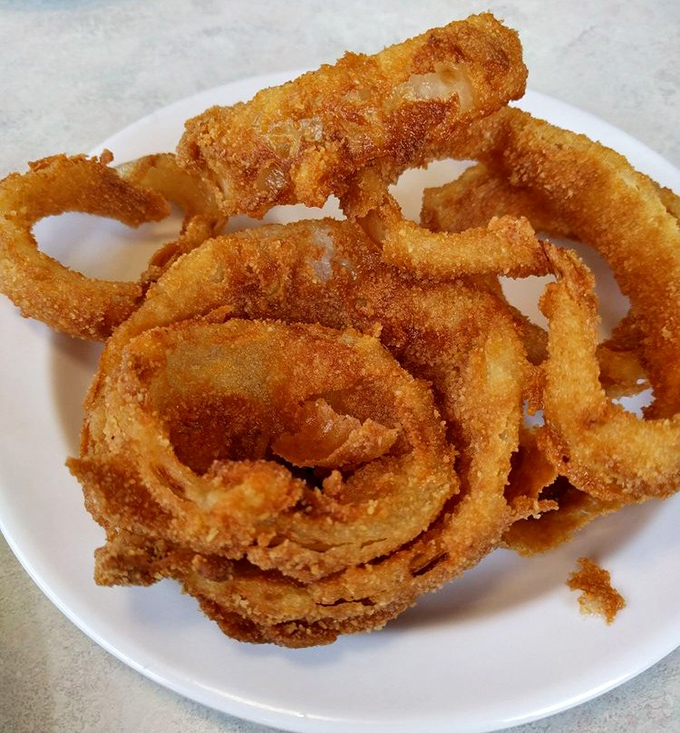 Golden halos of onion perfection that make you wonder why anyone bothered to invent molecular gastronomy when we already had these crispy miracles.