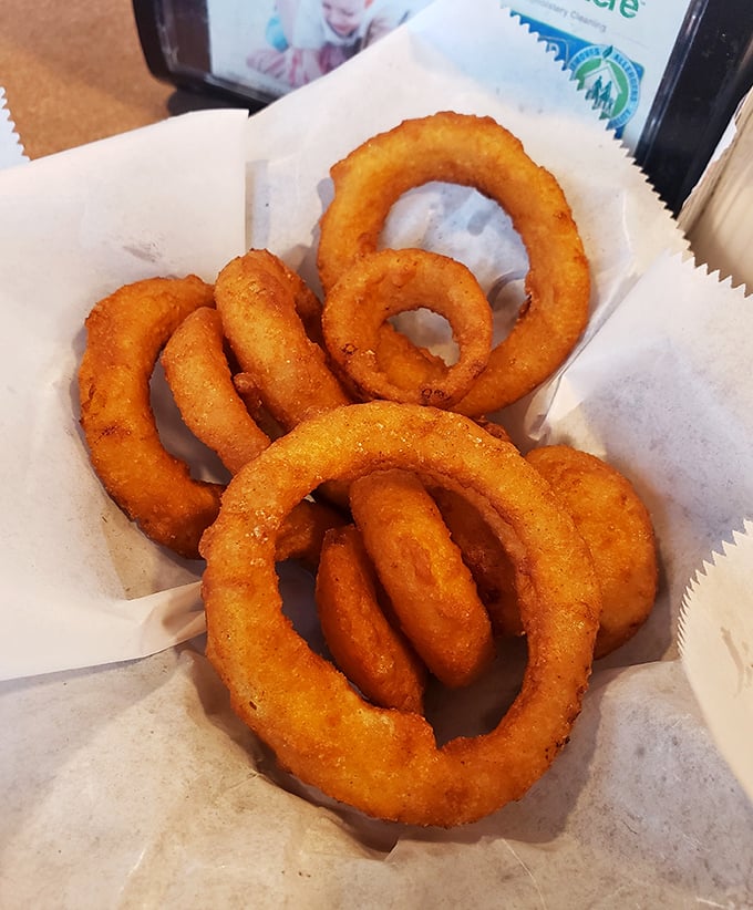 Golden rings of happiness that crunch loud enough to turn heads. These aren't just onion rings—they're edible jewelry for your taste buds.