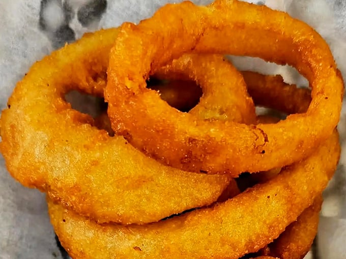 These aren't just onion rings; they're golden halos of crunch that make you temporarily forget you came for pizza in the first place.