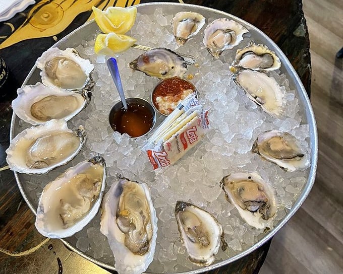 A dozen glistening oysters arranged like a clock face of oceanic delight. Each one a perfect little package of briny bliss waiting to be slurped.