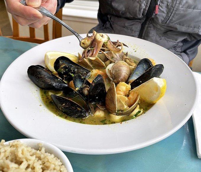 Shellfish heaven in a bowl. These mussels and clams aren't just swimming in broth—they're performing synchronized flavor diving.