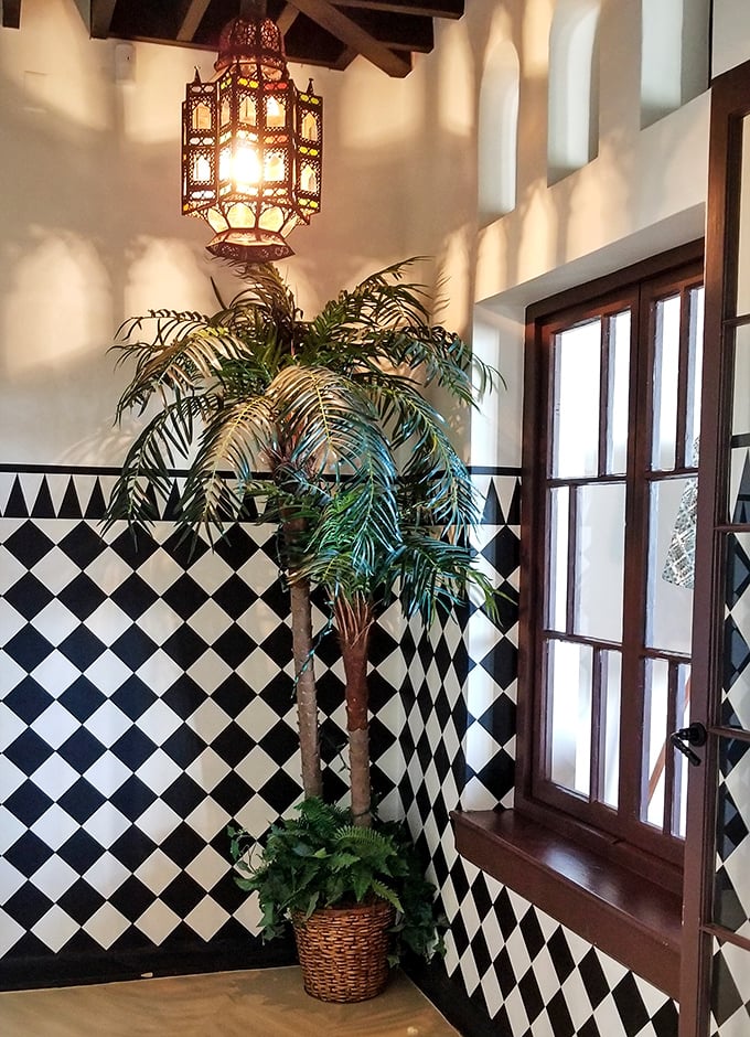 Even the hallways here refuse to acknowledge they're in Illinois, featuring checkerboard tiles and lanterns with serious attitude.