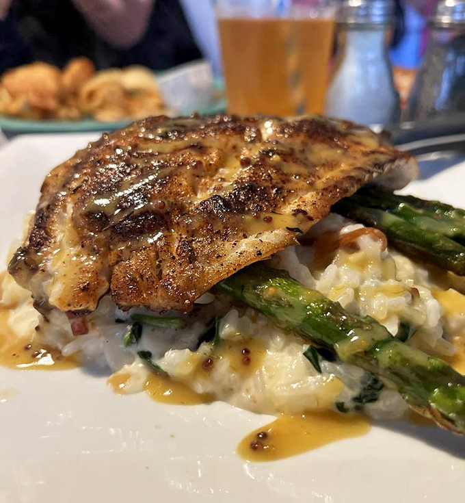 Pan-seared rockfish atop creamy risotto &ndash; when comfort food goes to finishing school and graduates with honors.