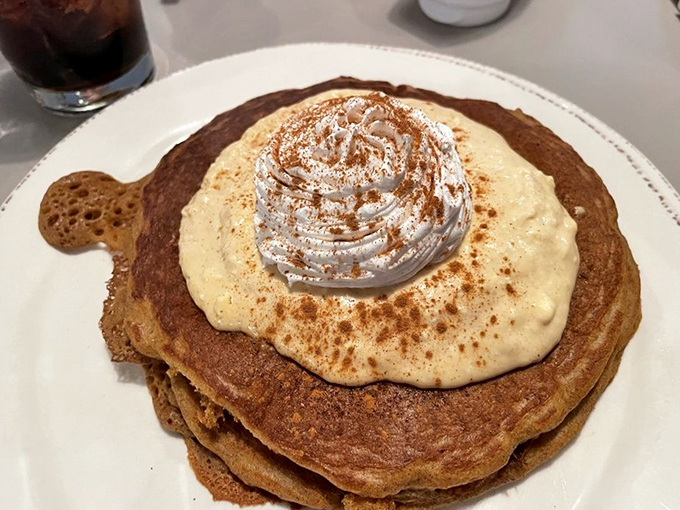 Pancake architecture at its finest&mdash;stacked high with cinnamon-dusted whipped cream that melts into every warm layer.