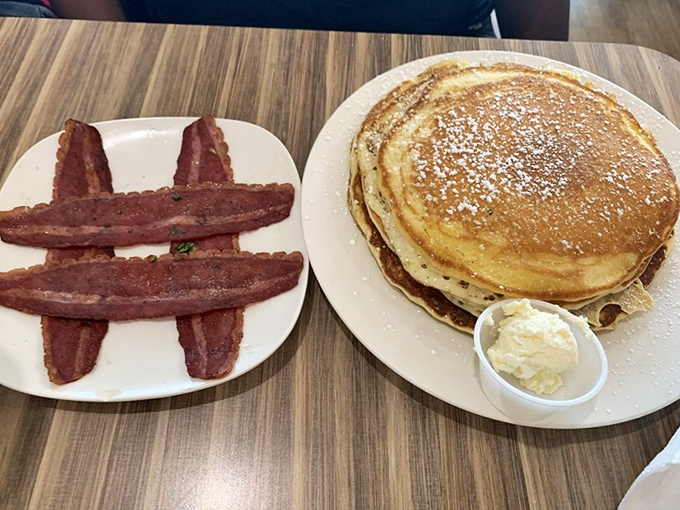 Golden pancakes with a side of perfectly crisped turkey bacon&mdash;proof that sometimes the classics deserve their legendary status for good reason.