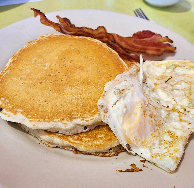 Breakfast nirvana exists, and it looks exactly like these golden pancakes with perfectly crisp bacon and eggs cooked just right.