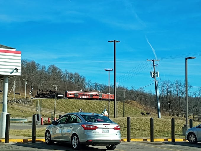 Trains and teepees in the distance! From this parking lot perspective, Bellville's quirky attractions beckon with the promise of small-town wonder under that impossibly blue Ohio sky.