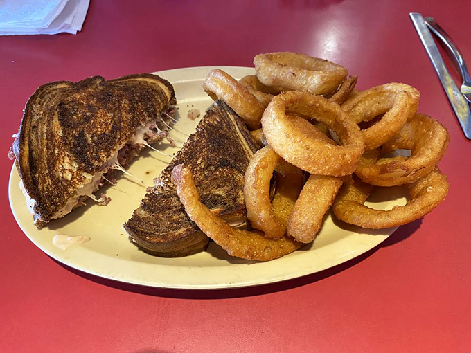 This patty melt isn't just grilled&mdash;it's been transformed into a work of art. Those onion rings aren't side characters; they're co-stars.