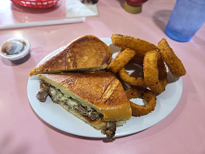 A patty melt that would make your cardiologist wince and your taste buds sing. Those onion rings aren't just sides&mdash;they're halos for this sandwich angel.