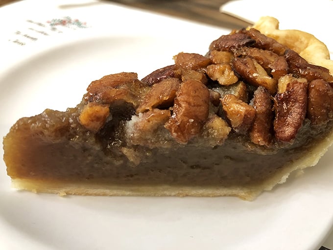 Not just any pecan pie – this is the kind that makes you close your eyes involuntarily, savoring that perfect balance of sweet filling and crunchy nuts.