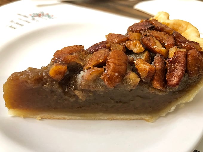 A slice of pecan pie with its glistening filling and perfectly arranged nuts &ndash; another dessert contender alongside that famous coconut cream.