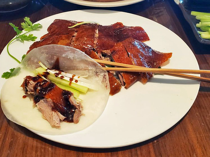 The legendary Peking duck arrives like royalty&mdash;crackling amber skin, tender meat, and all the traditional fixings for a DIY flavor explosion.