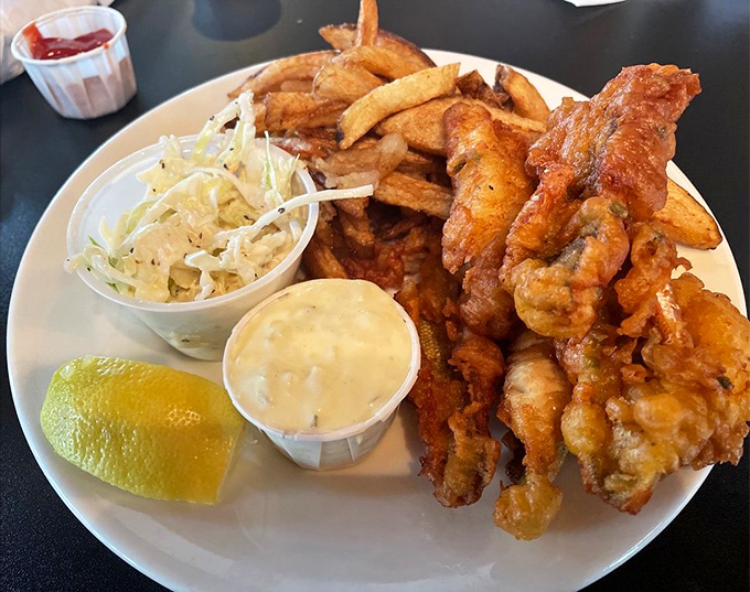 Lake Erie perch gets the royal treatment with golden breading, crisp fries, and homemade coleslaw&mdash;a trio that makes fish lovers weak in the knees.