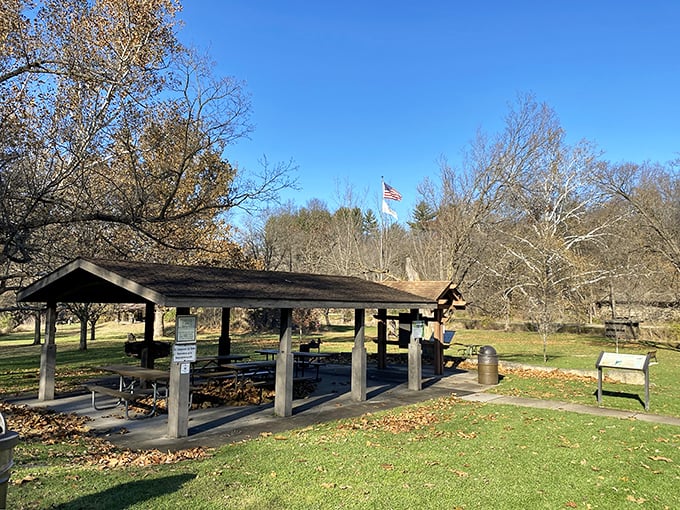 This rustic picnic pavilion has witnessed countless family gatherings, each one adding to the park's invisible scrapbook of memories.