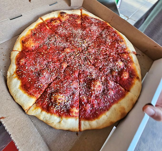 Lorenzo's tomato pie is the saucy, herb-dusted canvas that reminds you why simple pleasures often deliver the most profound satisfaction.