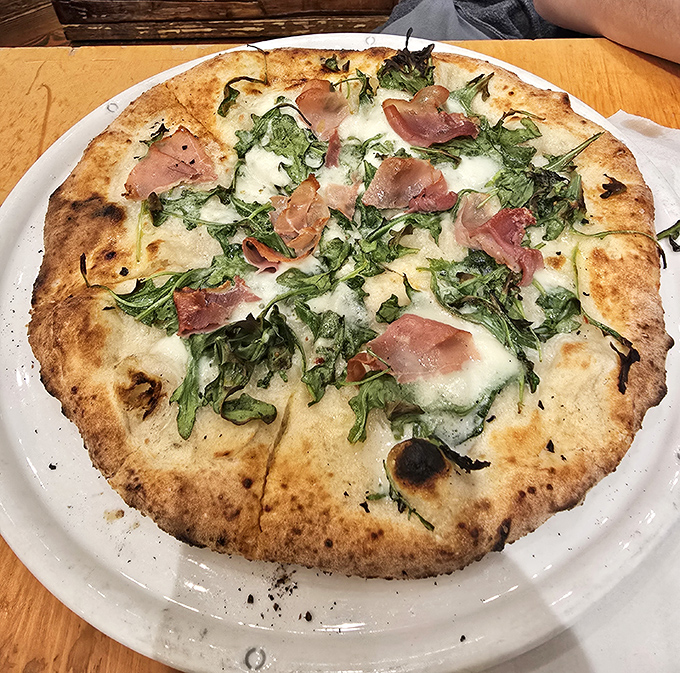 Who knew Amish country would deliver pizza this good? Crispy, wood-fired crust topped with prosciutto and fresh greens&mdash;a delicious culture clash.