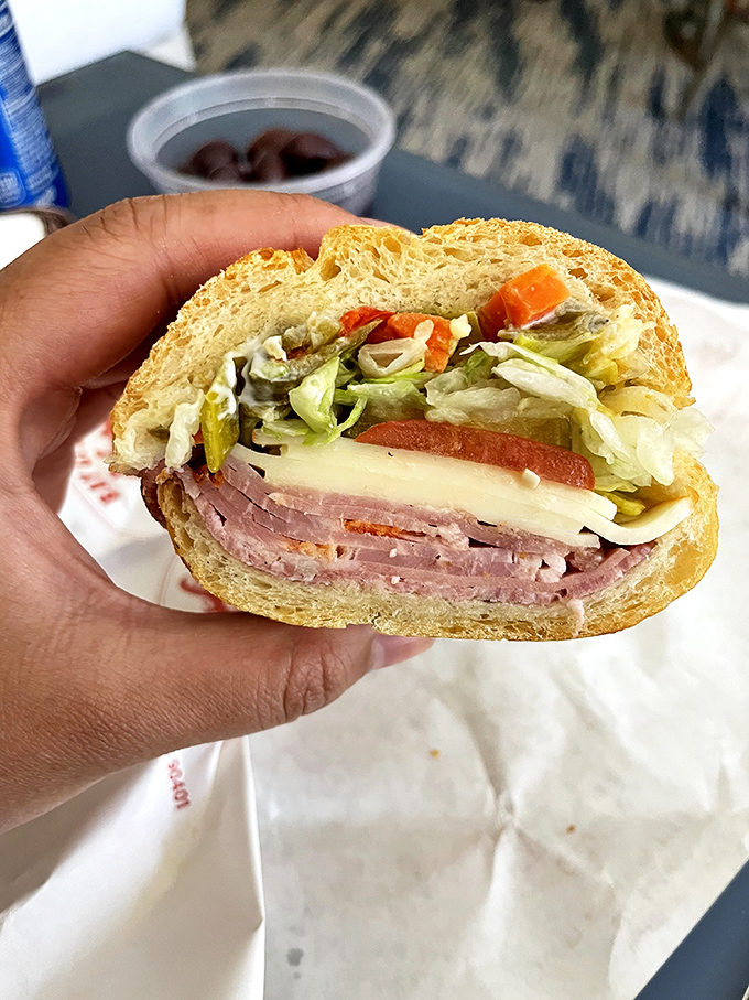 A cross-section reveals the sandwich's perfect ratio of meat to cheese to veggies&mdash;a harmony of flavors that makes music in your mouth.