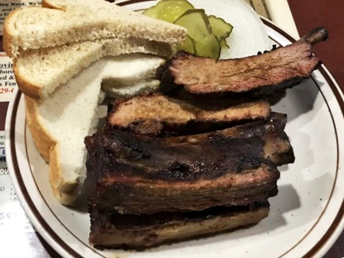 Those ribs have that beautiful mahogany color that only comes from hours of patient smoking and genuine pit master skill.