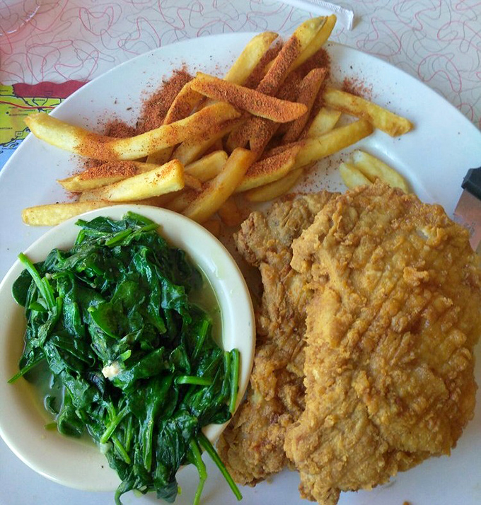 These pork chops arrive with black beans and greens, proving that diner food can be both hearty and surprisingly balanced.