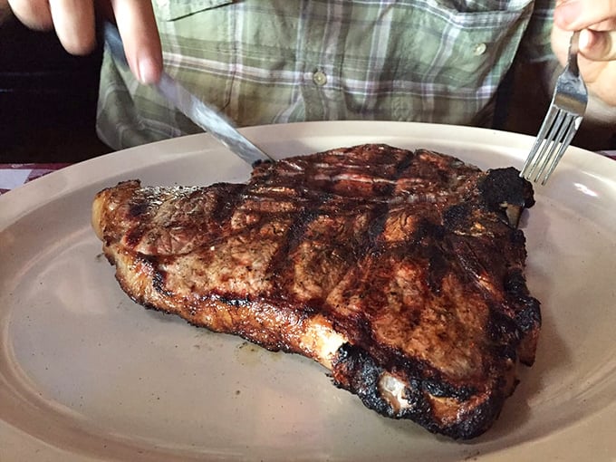 This porterhouse isn't just a steak&mdash;it's a declaration of independence from dainty dining. The char marks tell stories of mesquite flames.