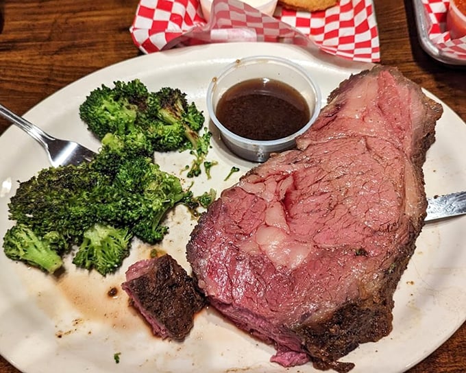 Prime rib so perfectly pink it makes flamingos jealous, accompanied by broccoli for that token nod to nutrition.