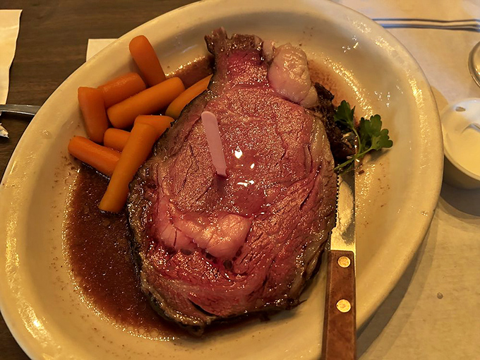 Prime rib so tender and juicy it practically poses for its portrait, surrounded by a supporting cast of perfectly cooked carrots.