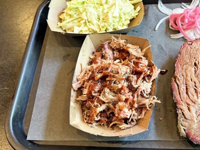 Pulled pork that doesn't need sauce to shine&mdash;each strand telling the story of patience, smoke, and time-honored technique.