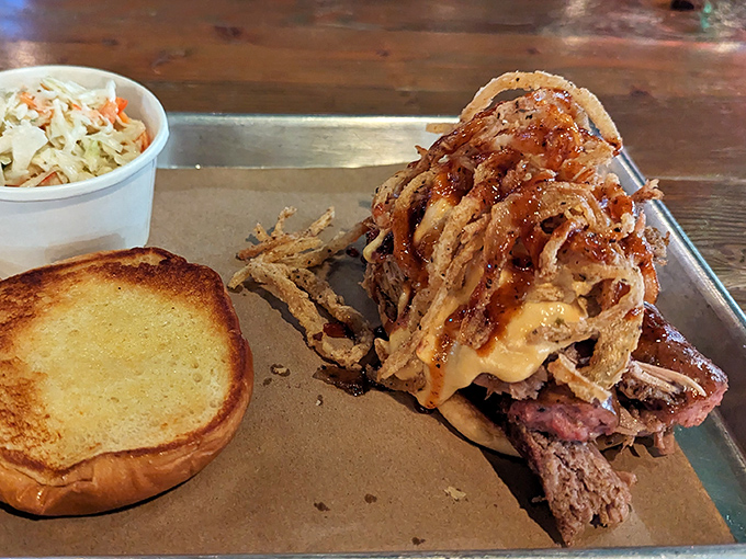 Pulled pork piled so high it defies gravity, accompanied by Texas toast ready for its moment of glory.