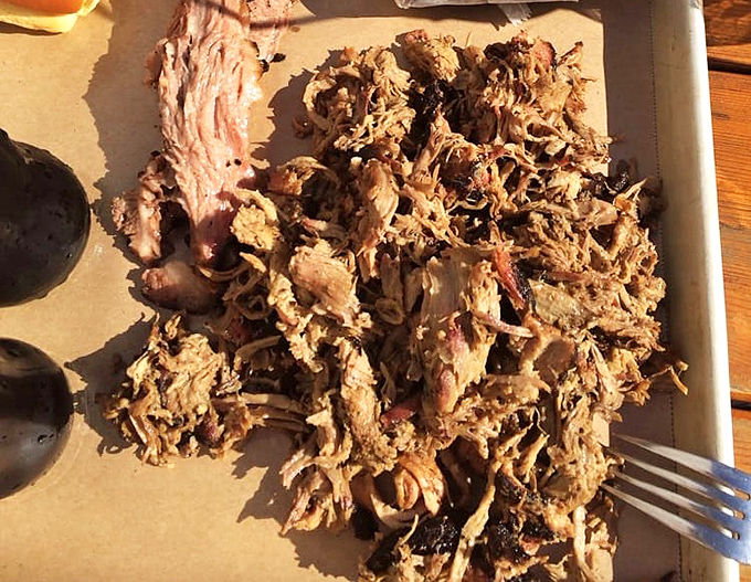 Pulled pork piled high like a smoky mountain of joy, proving that good things come to those who smoke low and slow.