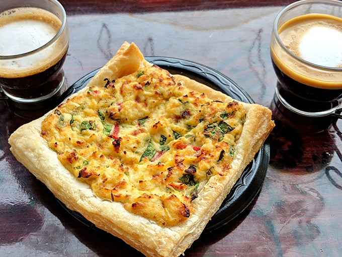 This quiche doesn't just sit there looking pretty&mdash;it demands your attention with its perfect puff pastry crust and savory filling. Coffee companionship perfected. 