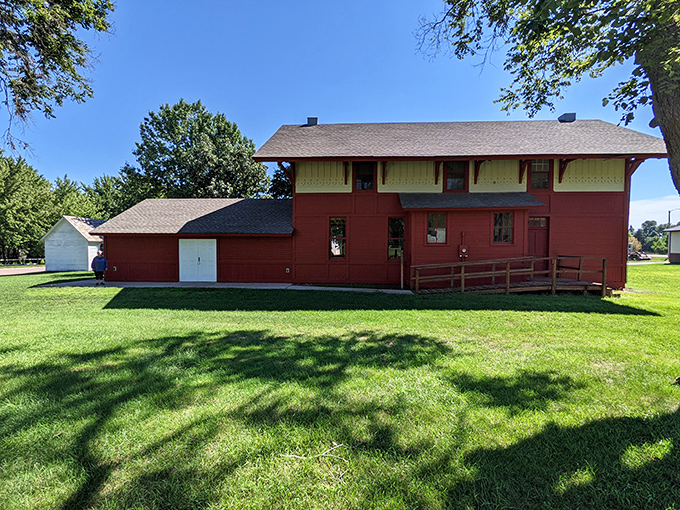 This red depot building whispers stories of arrivals and departures, standing as a crimson reminder of Flandreau's railroad past.