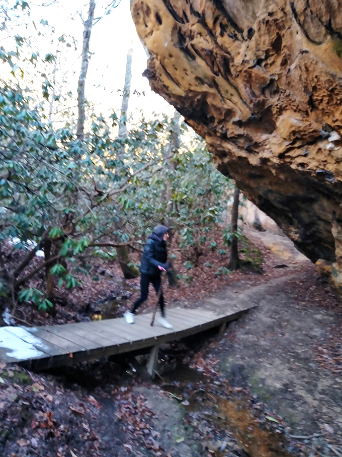 Mother Nature's architectural prowess on full display. This massive rock overhang provides shade, shelter, and a reminder of just how small we really are.