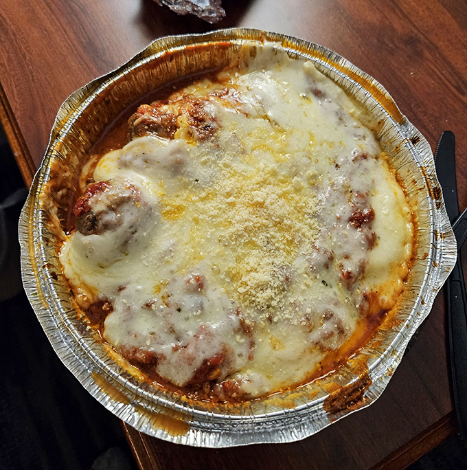 Ravioli and meatballs: the Fred Astaire and Ginger Rogers of Italian cuisine, dancing in perfect harmony on this plate.