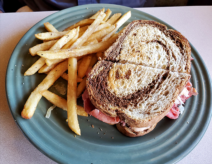 A proper Reuben should require both hands and several napkins. This beauty, with perfectly toasted marble rye, meets all sandwich requirements with flying colors.