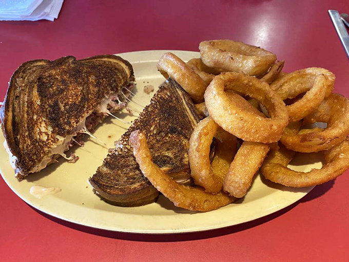 This grilled Reuben sandwich pulls apart with melty cheese strings that would make any food photographer weep with joy.