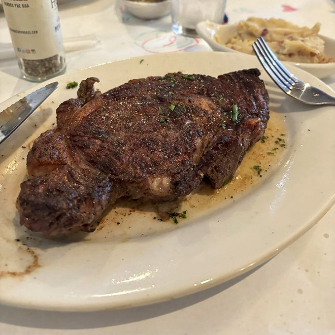 A ribeye so magnificently crusted and tender, it practically demands its own standing ovation from your taste buds.