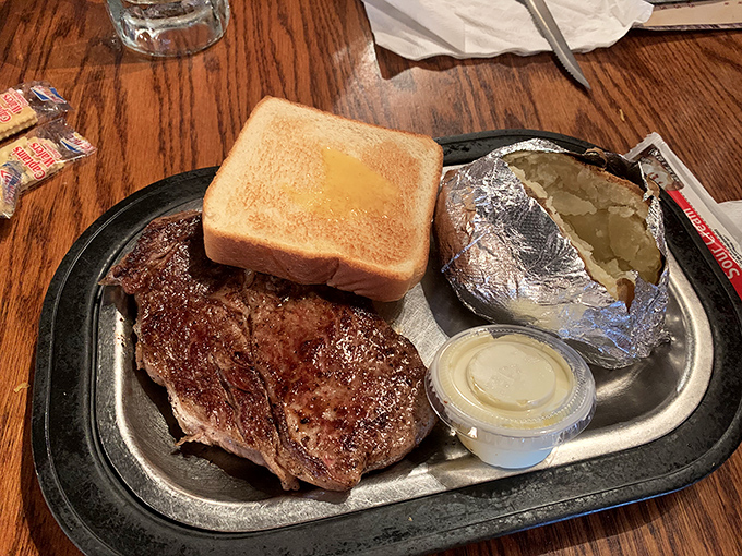 A steak, a spud, and Texas toast – the holy trinity of satisfaction. This ribeye doesn't need fancy presentation to prove its worth.