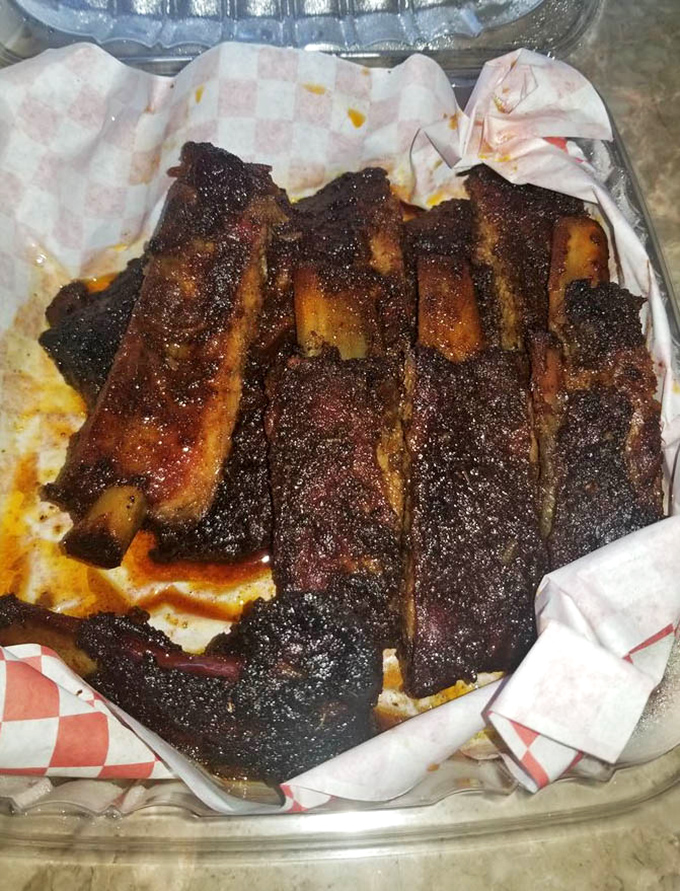 These ribs wear their bark like a badge of honor. That smoke ring isn't just pretty&mdash;it's a PhD in patience and proper temperature control.