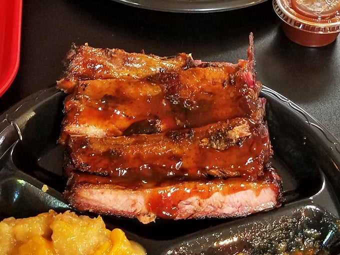 Ribs glazed to perfection &ndash; where sauce meets smoke in a dance as choreographed as Fred and Ginger. The meat's barely hanging on to the bone.