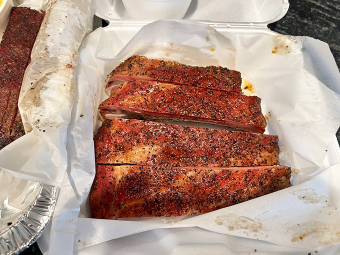 That gorgeous mahogany color and perfectly rendered fat tell you these ribs have spent quality time in the smoker.