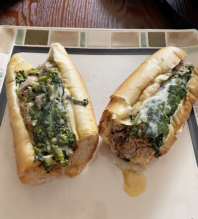 The roast pork sandwich with broccoli rabe &ndash; where tender meat and bitter greens create a relationship more balanced than most marriages.