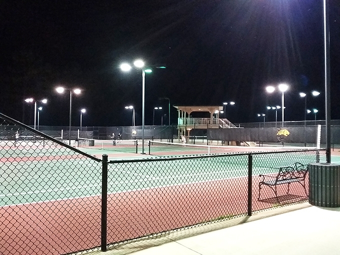 Russellville's tennis complex shines under night lights, where weekend warriors channel their inner Serena on courts that forgive amateur backhands.