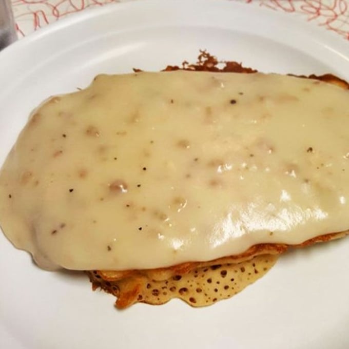 What looks like a simple pancake hides a delicious secret &ndash; melted cheese that transforms this breakfast staple into something worth crossing county lines for.