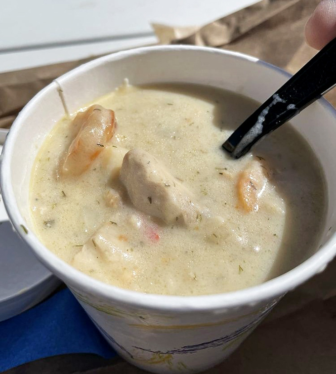 A cup of creamy seafood chowder that warms the soul and makes you question why you'd ever eat anything else.