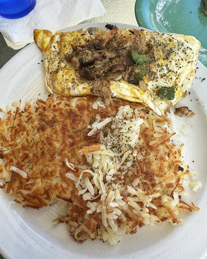 This seafood omelet looks like it could solve world peace, one delicious bite at a time.