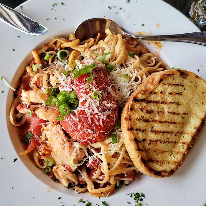 Seafood pasta that would make Neptune himself put down his trident and pick up a fork&mdash;a symphony of flavors topped with enough parmesan to make Italy jealous.