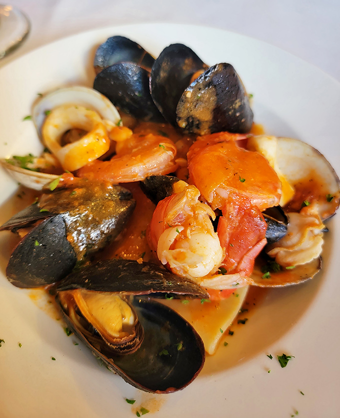 A symphony of seafood in tomato broth – mussels, clams, and shrimp playing together like the world's tastiest orchestra.