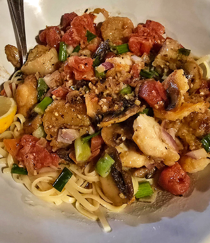 This isn't just pasta—it's a Mediterranean vacation. Seafood and linguine playing together like old friends at a delicious reunion.