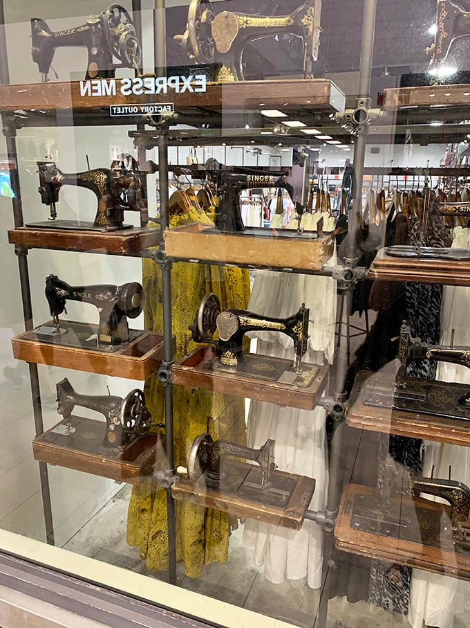 Vintage Singer sewing machines displayed like museum artifacts. A reminder of craftsmanship from an era before "fast fashion" was even a concept.