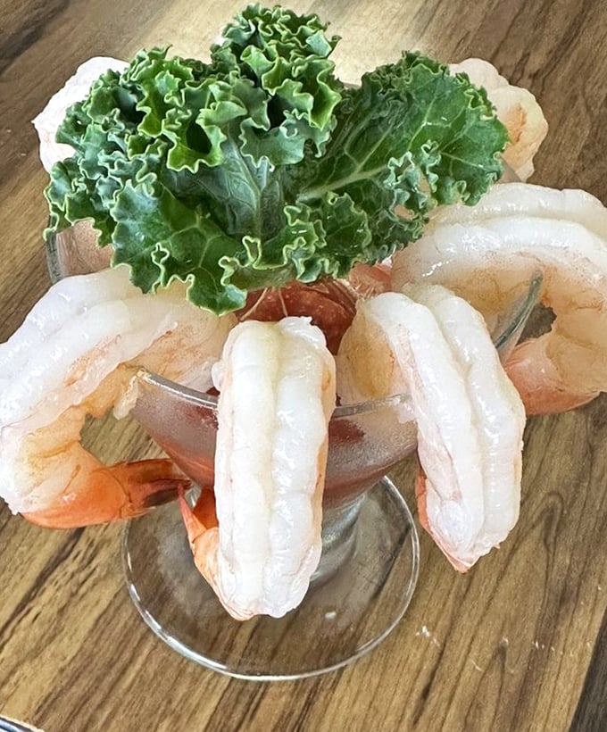 Shrimp cocktail that looks like it jumped straight from the ocean. Plump, pristine crustaceans arranged with the care of a seafood jeweler.